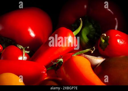 mini bell pepper mix on black background Stock Photo - Alamy