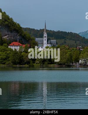 The magical atmosphere of Lake Bled in autumn. Among boats and mystical ...