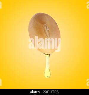 Cooking oil dripping from soybean on yellow background Stock Photo - Alamy