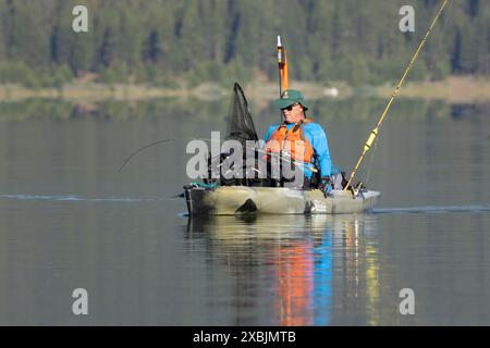 SUSANVILLE CALIFORNIA, USA – JUNE 12, 2024: A female kayak angler ...