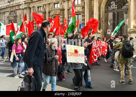 People with Palestinian and Communist flags at the annual parade of the ...