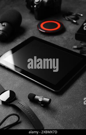 Different gadgets on dark background Stock Photo - Alamy