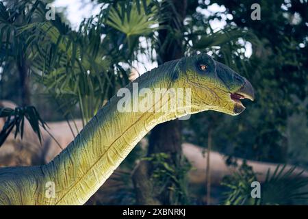 Toy dinosaur Therizinosaurus, a prehistoric creature, on transparent ...