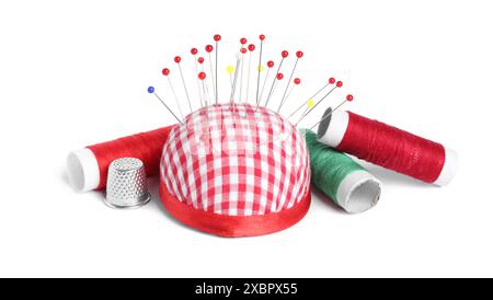 Checkered pincushion with sewing pins, spools of threads and measuring ...