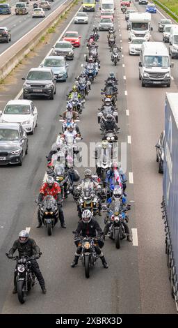 Photo of group of motorbikes in heavy traffic congestion on the M6 ...