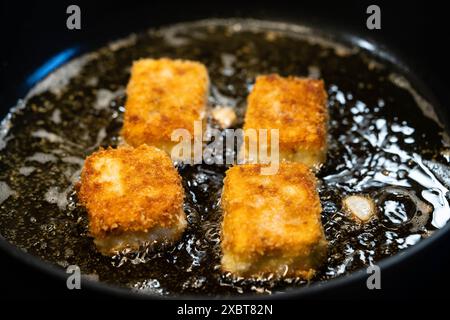 breaded and baked greek sheep's cheese with herbs and spices Stock ...