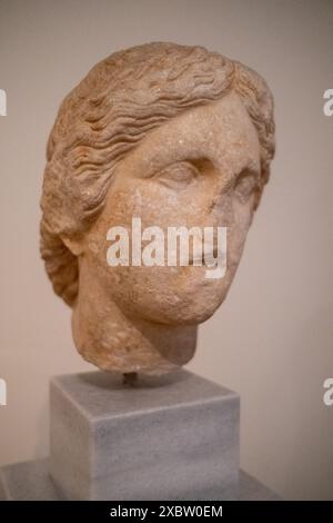 An ancient statue of a noseless face in white marble at the National ...