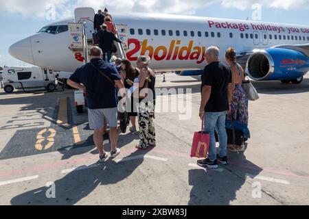 Picture dated May 2024 shows passengers boarding a Jet2 plane at Ibiza ...