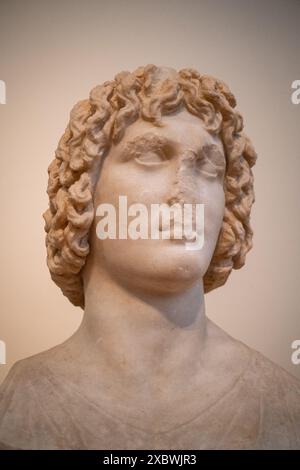 An ancient statue of a noseless face in white marble at the National ...