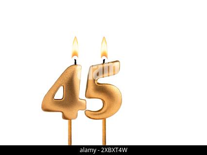Number 45 gold celebration candle and small stars in sweet cupcake on ...