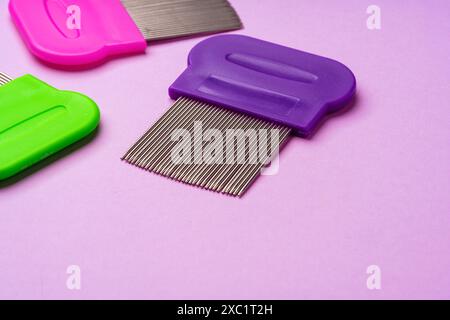 Three combs for removing lice and nits on lilac background Stock Photo ...