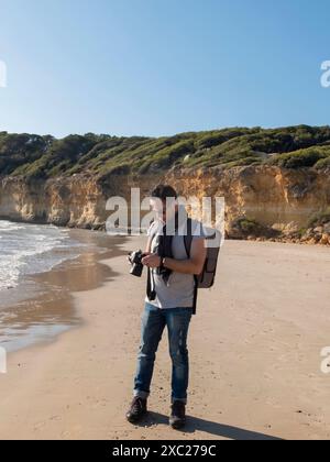 Backside view of photographer taking photo of beautiful multiracial ...