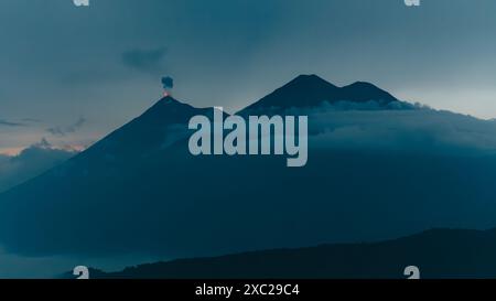 Fuego volcano from Antigua Guatemala during blue hour Stock Photo - Alamy