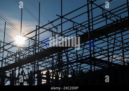 Scaffolding and tarpaulins - at a construction site for a new factory ...