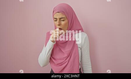 Beautiful woman coughing against an isolated yellow background Stock ...