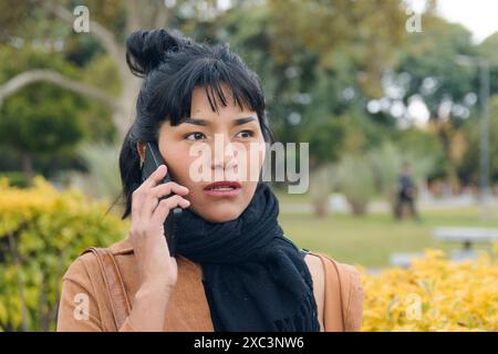Native latin american female student with group of students outdoor in ...