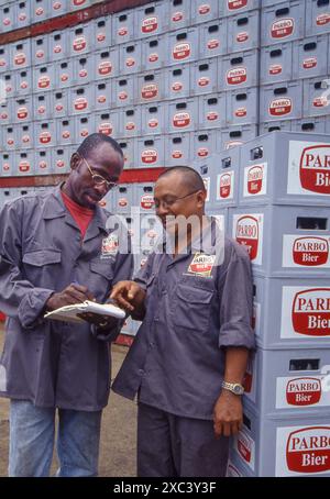 Suriname, Paramaribo - Factory workers of the Parbo beer brewery, a ...