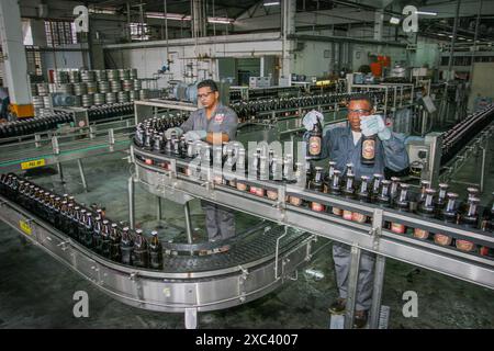 Suriname, Paramaribo - Factory workers of the Parbo beer brewery, a ...