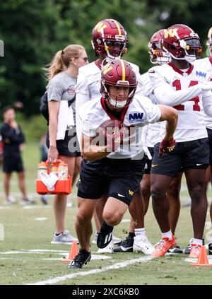 Washington Commanders wide receiver Luke McCaffrey (11) runs with the ...