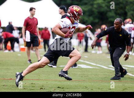 Washington Commanders wide receiver Luke McCaffrey (11) runs after ...