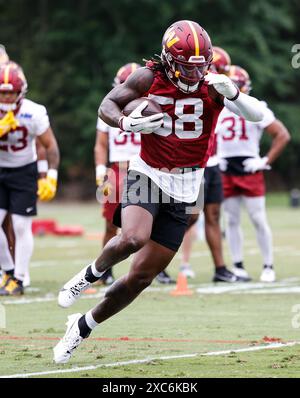 Washington Commanders linebacker Jordan Magee (58) works out during NFL ...