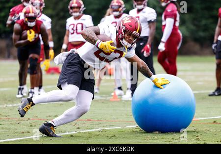 Washington Commanders running back Chris Rodriguez Jr. (36) scores past ...