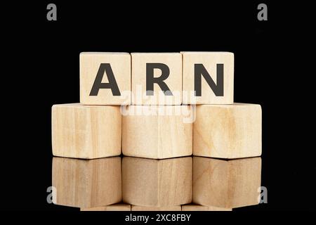 ARN as Account Reference Number word is made up of wooden cubes on a ...