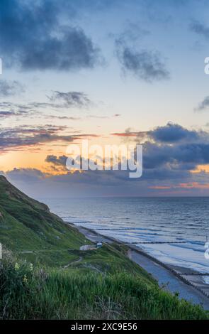 Trimingham beach sunset colours at dusk in landscape orientation Stock ...