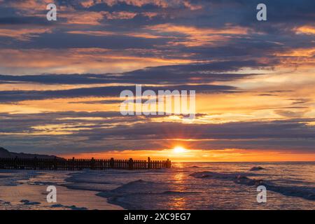 Trimingham beach sunset colours at dusk in landscape orientation Stock ...