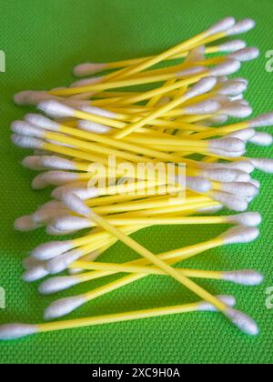 Cotton swabs on yellow background, space for text Stock Photo - Alamy