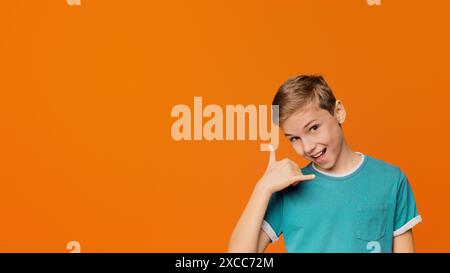 Communication concept. Flirty boy making call me gesture, smiling at ...