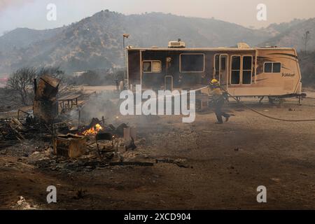 Gorman, California, USA. 15th June, 2024. A Cal Fire Helicopter drops ...