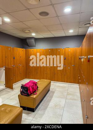 Wooden bench and lockers in changing room interior Stock Photo - Alamy