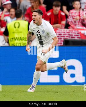 Slovenia's Erik Janza celebrates after scoring their side's first goal ...