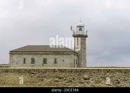 Historic Punta Nati Lighthouse complex in Menorca featuring stone ...