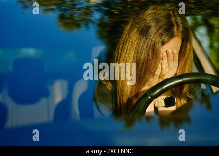 Woman feeling stressed and tired while driving or stuck in traffic ...