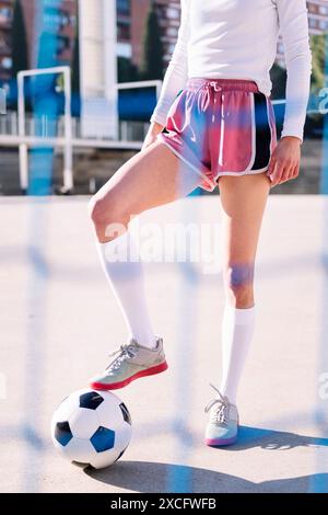 legs of a football player stepping a soccer ball Stock Photo - Alamy