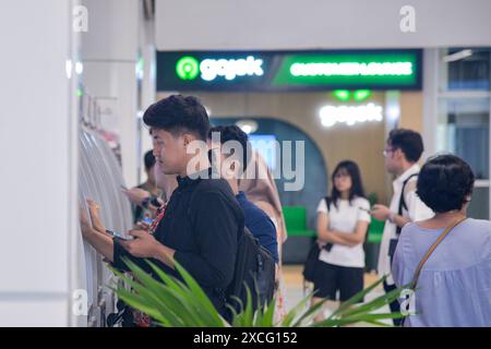 Jakarta, Indonesia. 17th June, 2024. Children pose for photos with a model of a high-speed ...