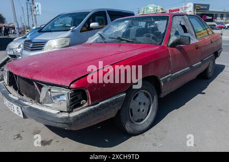 heavily used falling apart taxi car at the street of Central Asia Stock ...