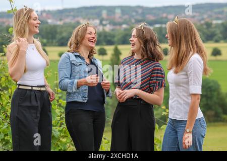 Family stand against vineyard in early spring Stock Photo - Alamy