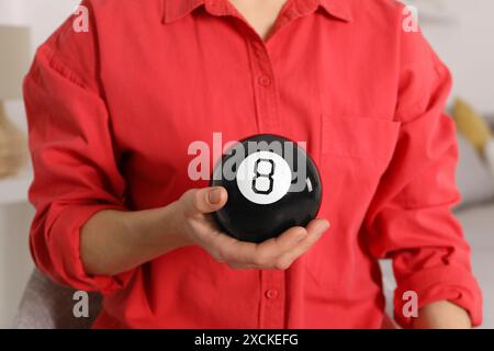Woman holding magic eight ball on white background, closeup Stock Photo ...