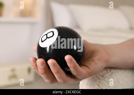 Man holding magic eight ball on white background, closeup Stock Photo ...