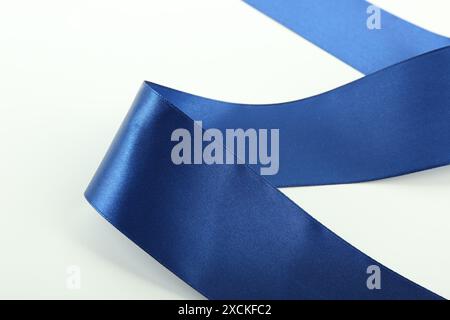 Beautiful blue ribbon isolated on white, top view Stock Photo - Alamy
