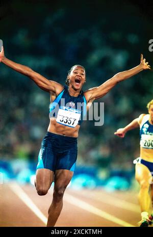 Marion Jones (USA) wins the gold medal in the women's 100m at the 2000 ...
