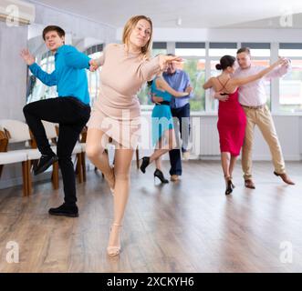Dynamic pair engaging in Latino dance in dance studio. Pairs training ...