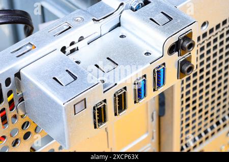 Multiple ports on front of computer case show with USB and audio ports ...