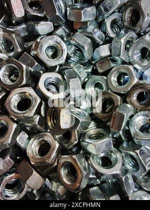 Lots of iron nuts, top view Stock Photo - Alamy