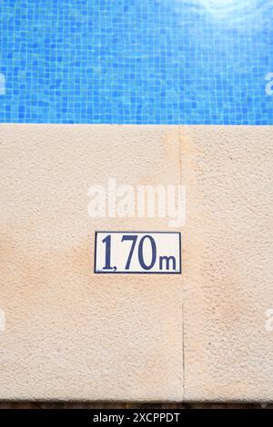 swimming pool depth marker Stock Photo - Alamy