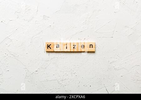 kaizen word written on wood block. kaizen text on table, concept Stock ...