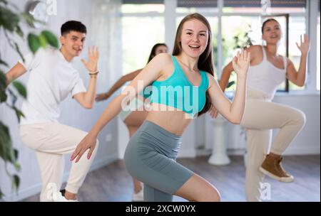 girl trains group dance movements at a choreography lesson Stock Photo ...